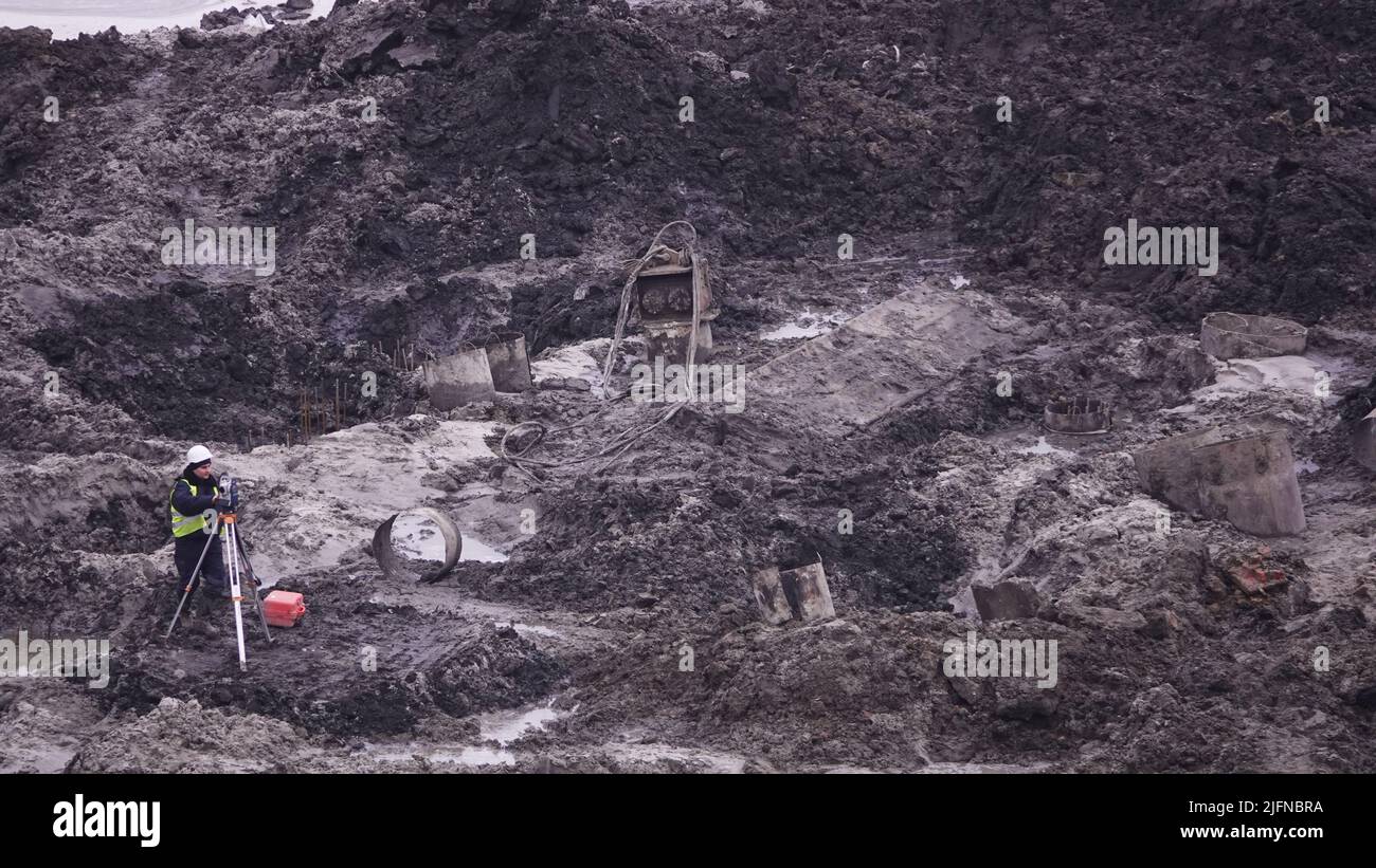 Kiev, Ukraine, October 17, 2018: Workers in the mud of a construction ...