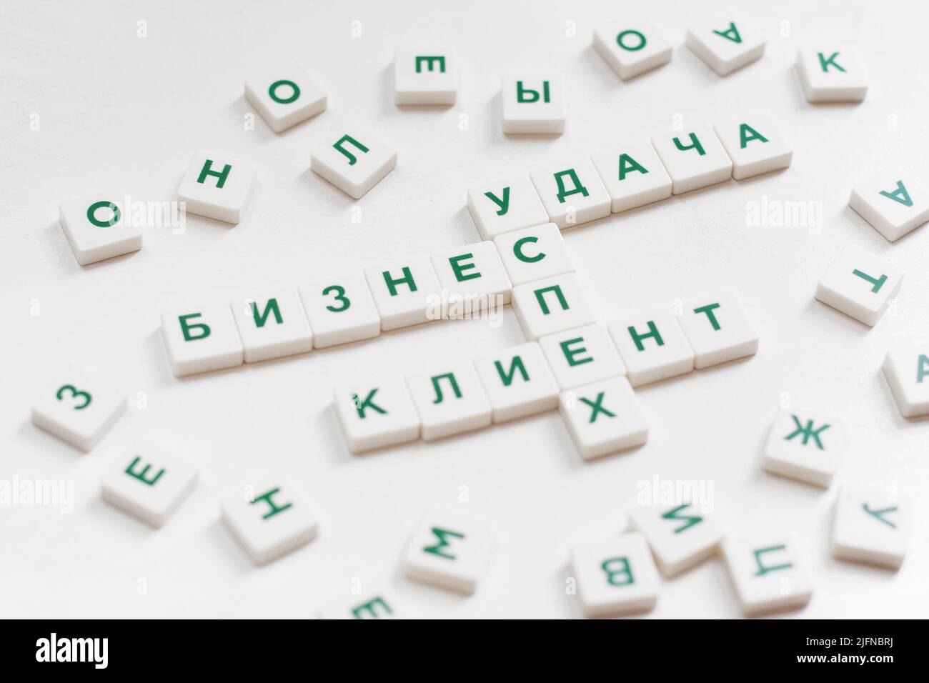 Scrabble words in russian, business concept Stock Photo - Alamy
