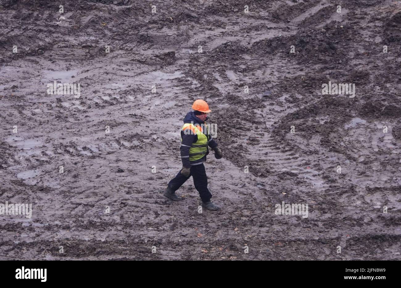 Kiev, Ukraine, October 17, 2018: Workers in the mud of a construction ...