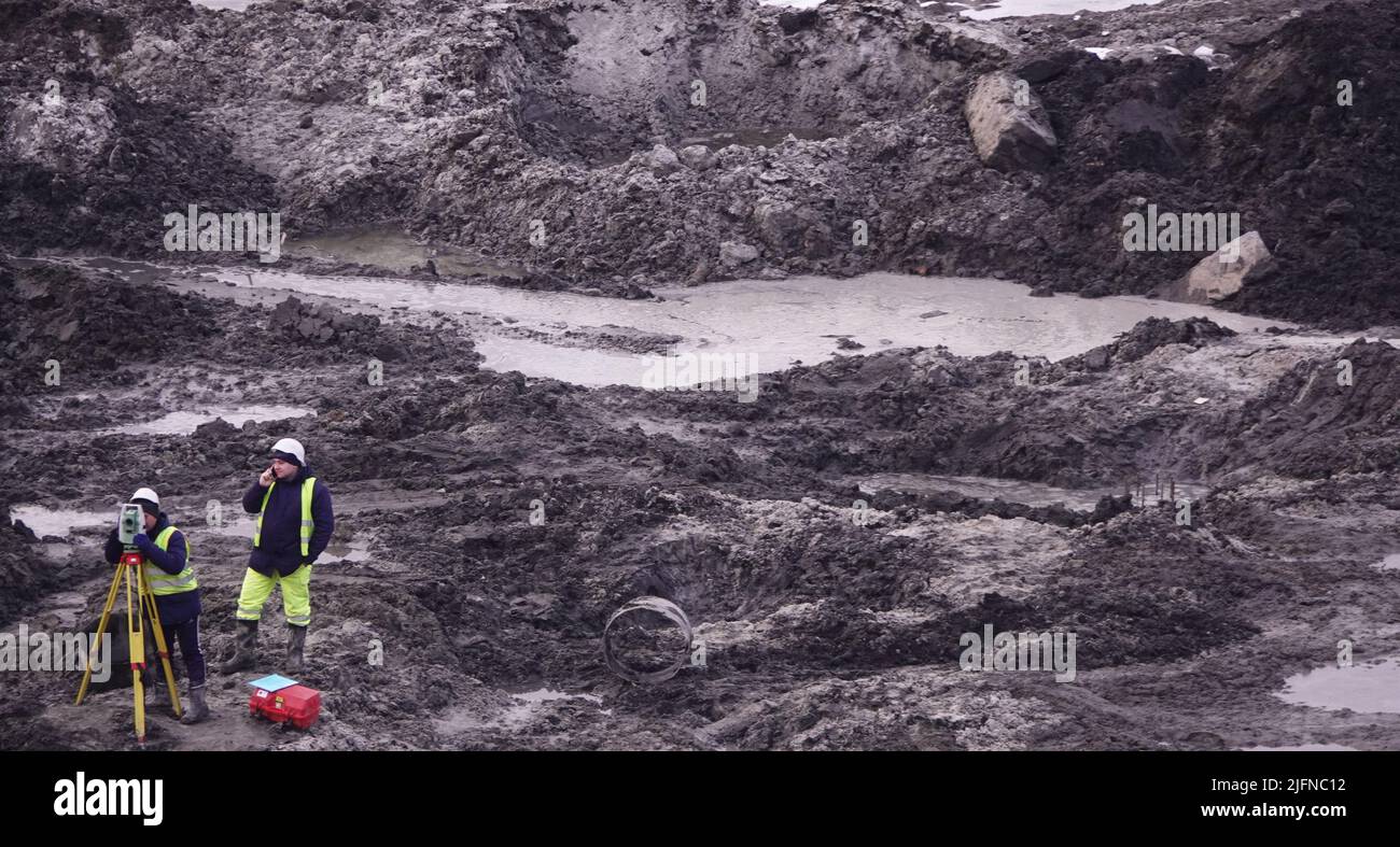 Kiev, Ukraine, October 17, 2018: Workers in the mud of a construction ...