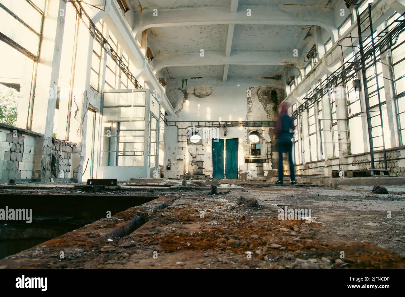 Person standing with hope on ruins of destroyed during war fighting ...