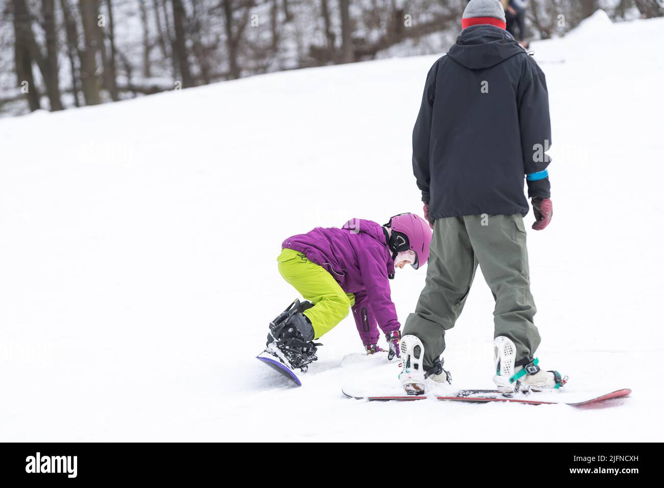 Ski Resort Father Teaching Little Daughter Snowboarding Stock Photo - Alamy