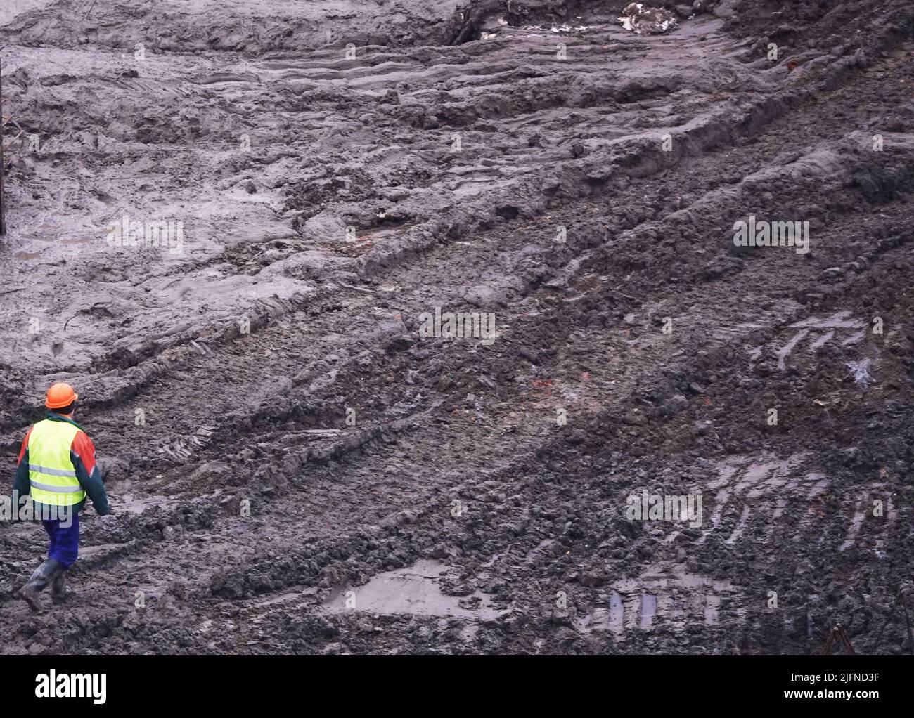 Kiev, Ukraine, October 17, 2018: Workers in the mud of a construction ...