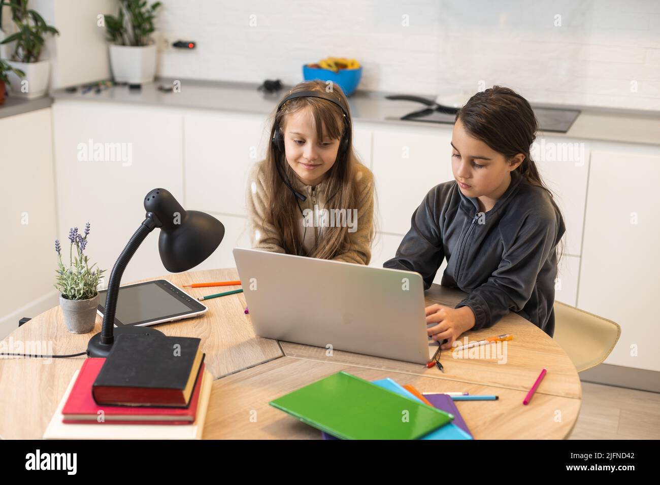 Two beautiful girls study at home Stock Photo - Alamy
