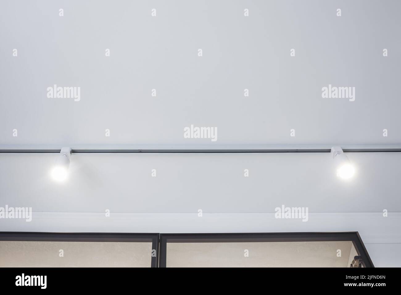 suspended ceiling with halogen spots lamps and drywall construction in ...