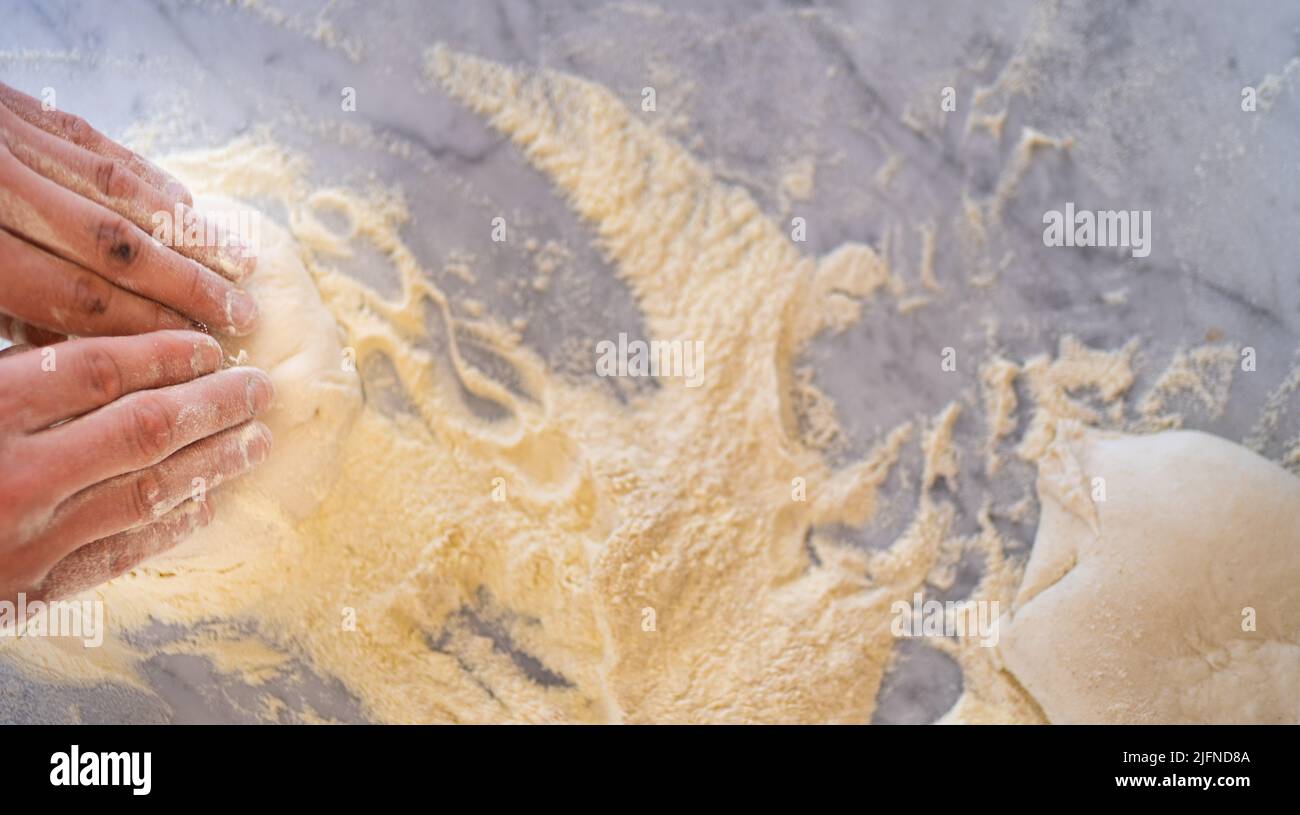 pizza chef preparing the typical neapolitan pizza, wit semolina and ...