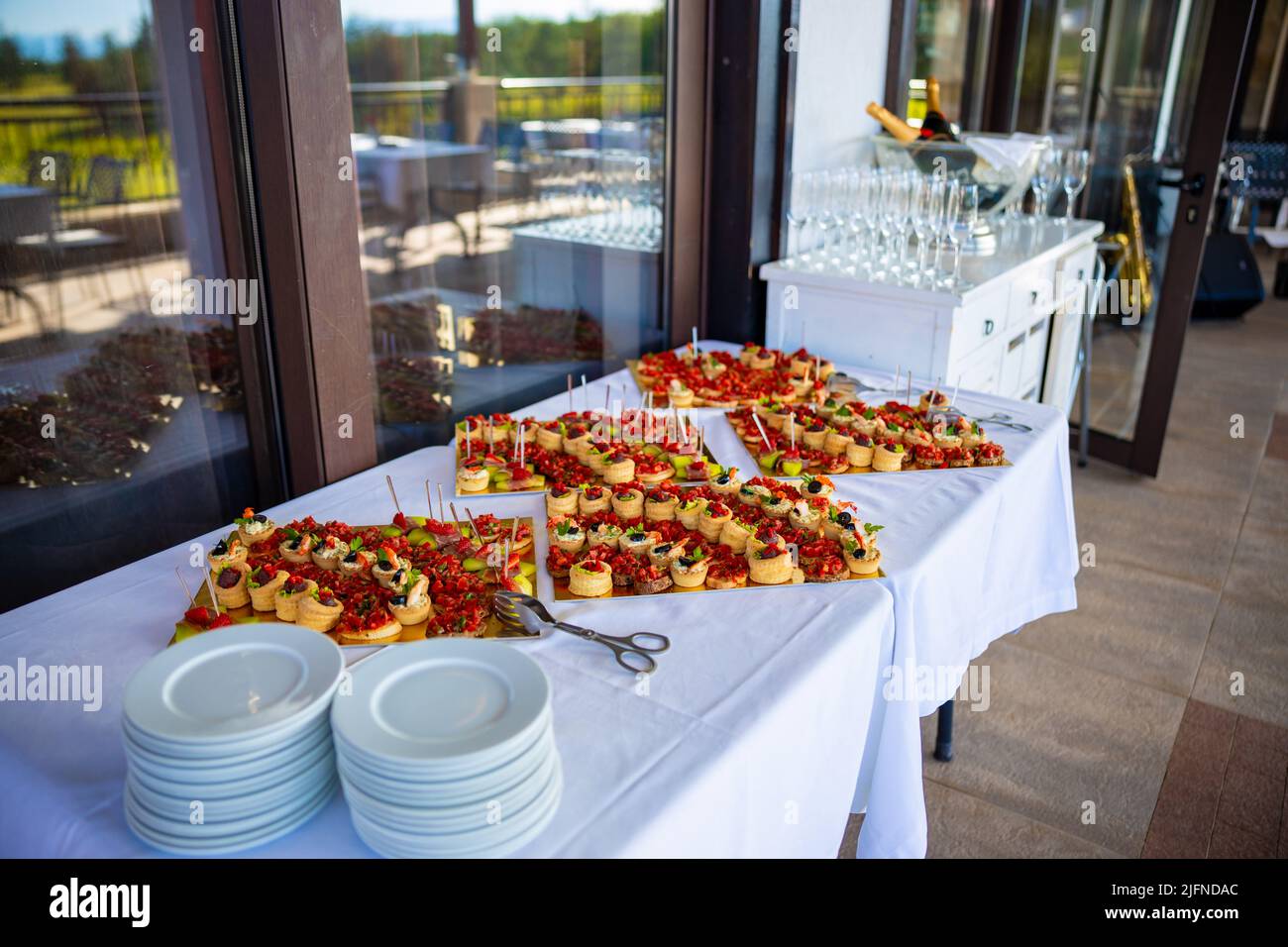 Different canapes with smoked salmon, cucumber cherry tomatoes and ...