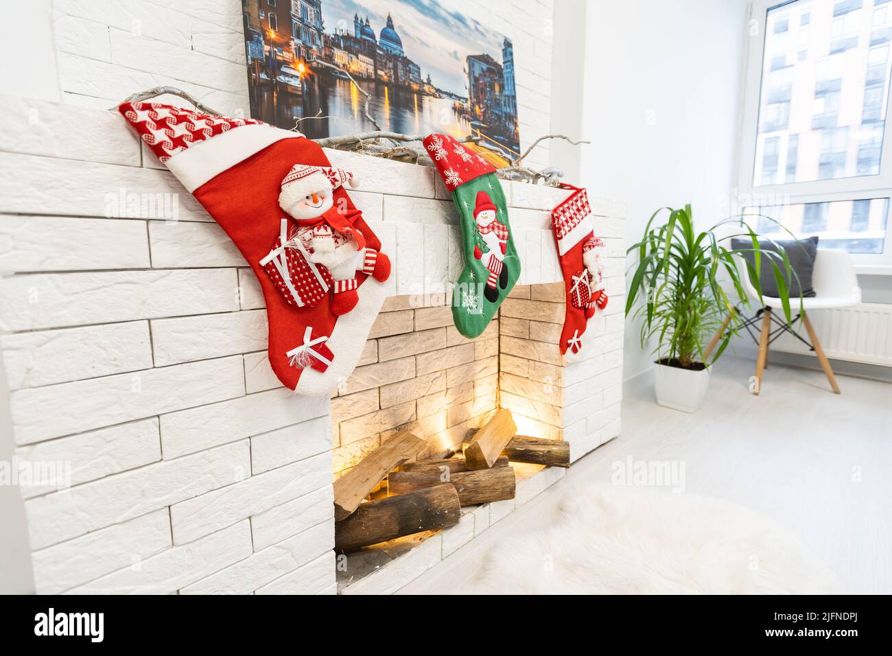 Christmas stocking on fireplace background Stock Photo - Alamy