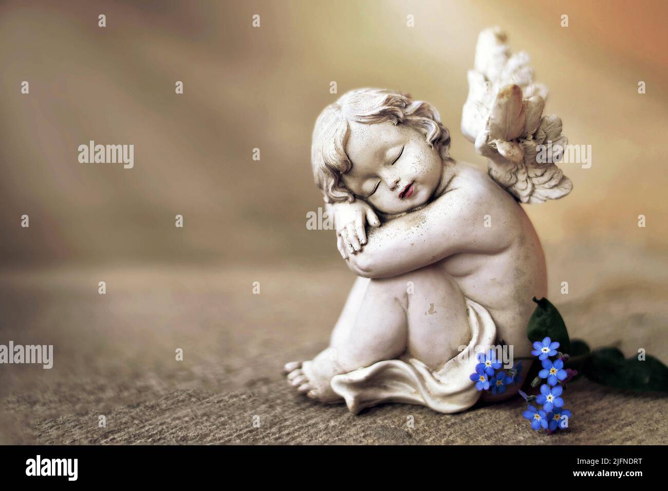 Guardian angel and spring flowers Stock Photo - Alamy