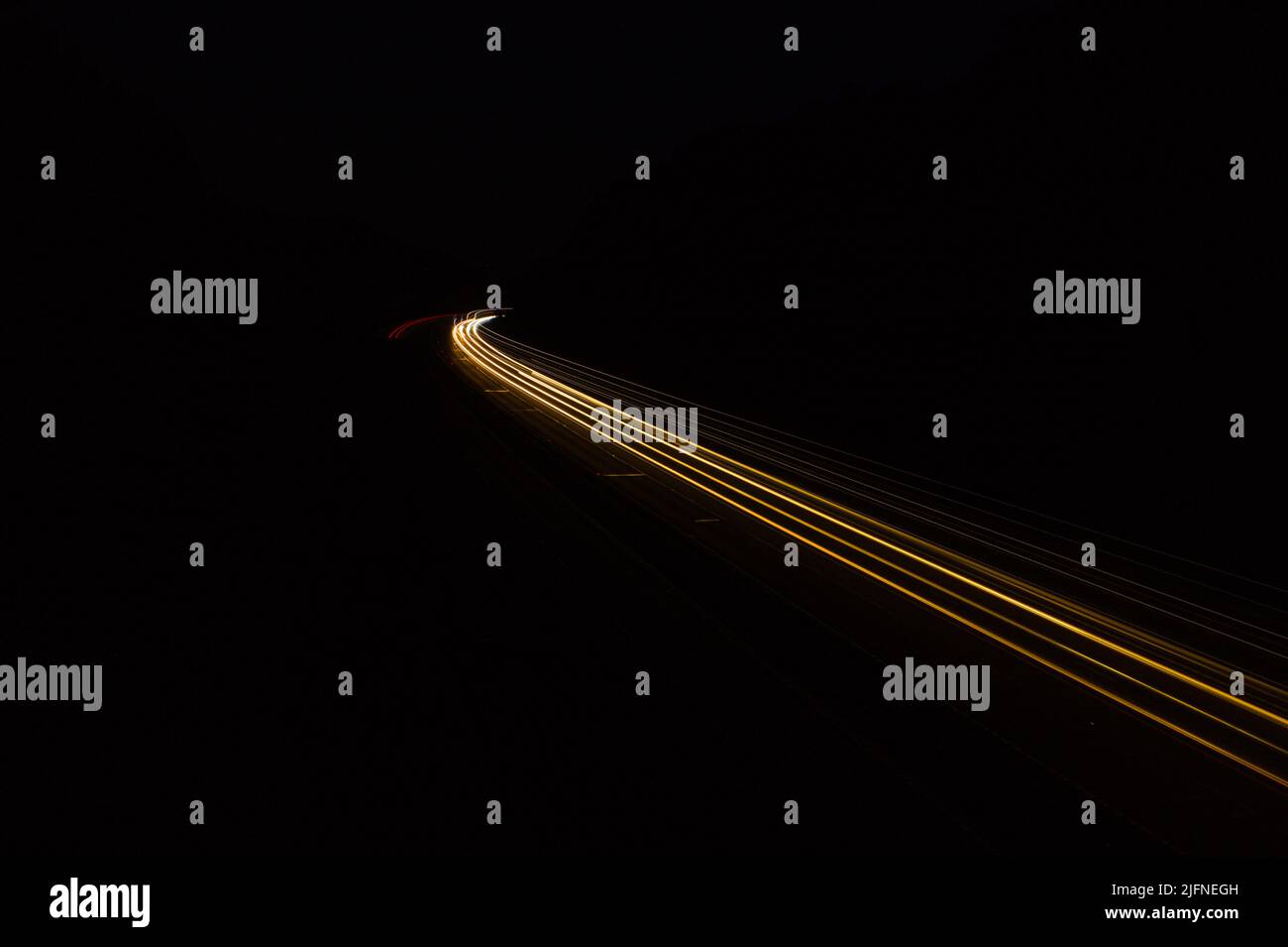 car driving on the highway headlights streaking Stock Photo - Alamy