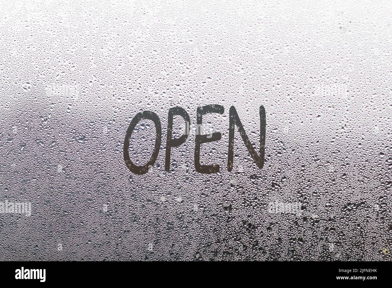 Open written on a foggy window Stock Photo - Alamy