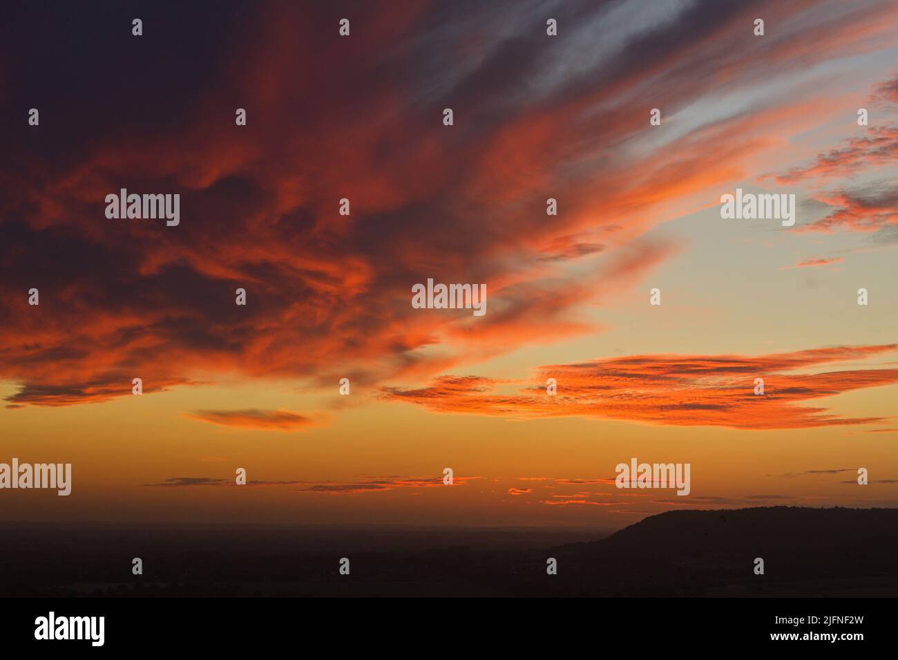 deep red fire in the clouds sunrise Stock Photo - Alamy