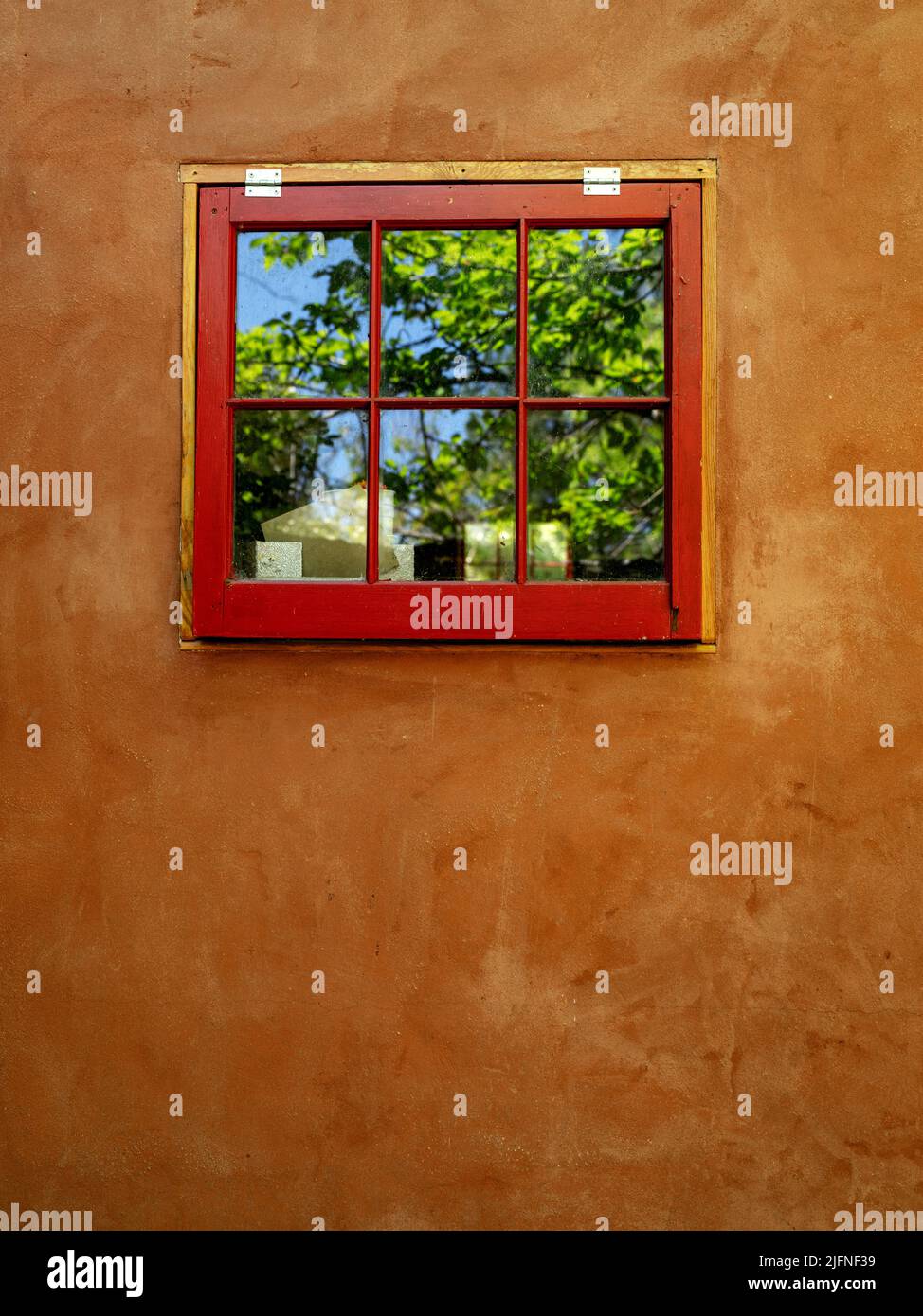 Wilderness reflection in the glass of a single window Stock Photo - Alamy