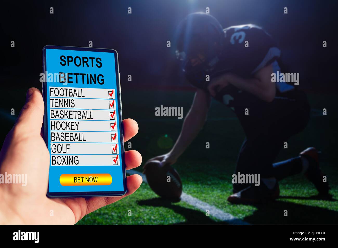 Football player looking cell phone hi-res stock photography and images ...