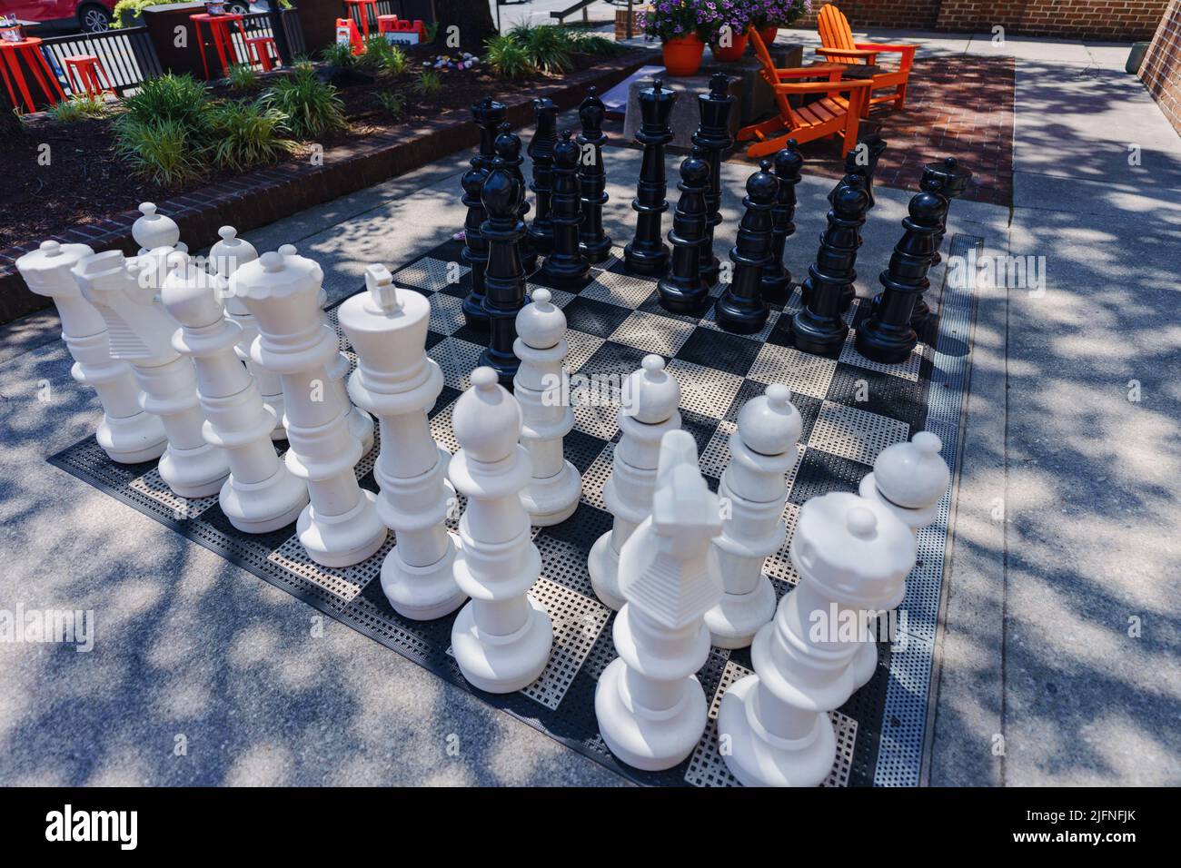 A large outside chess set awaits strategic thinking challengers at a ...