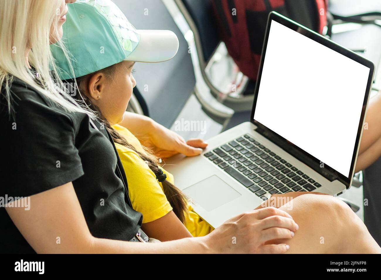 mother and daughter with laptop with blank screen Stock Photo - Alamy