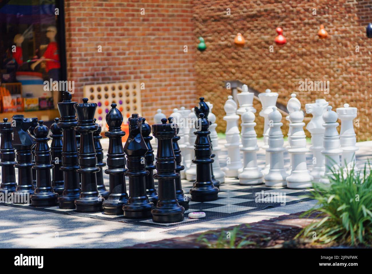 A large outside chess set awaits strategic thinking challengers at a ...