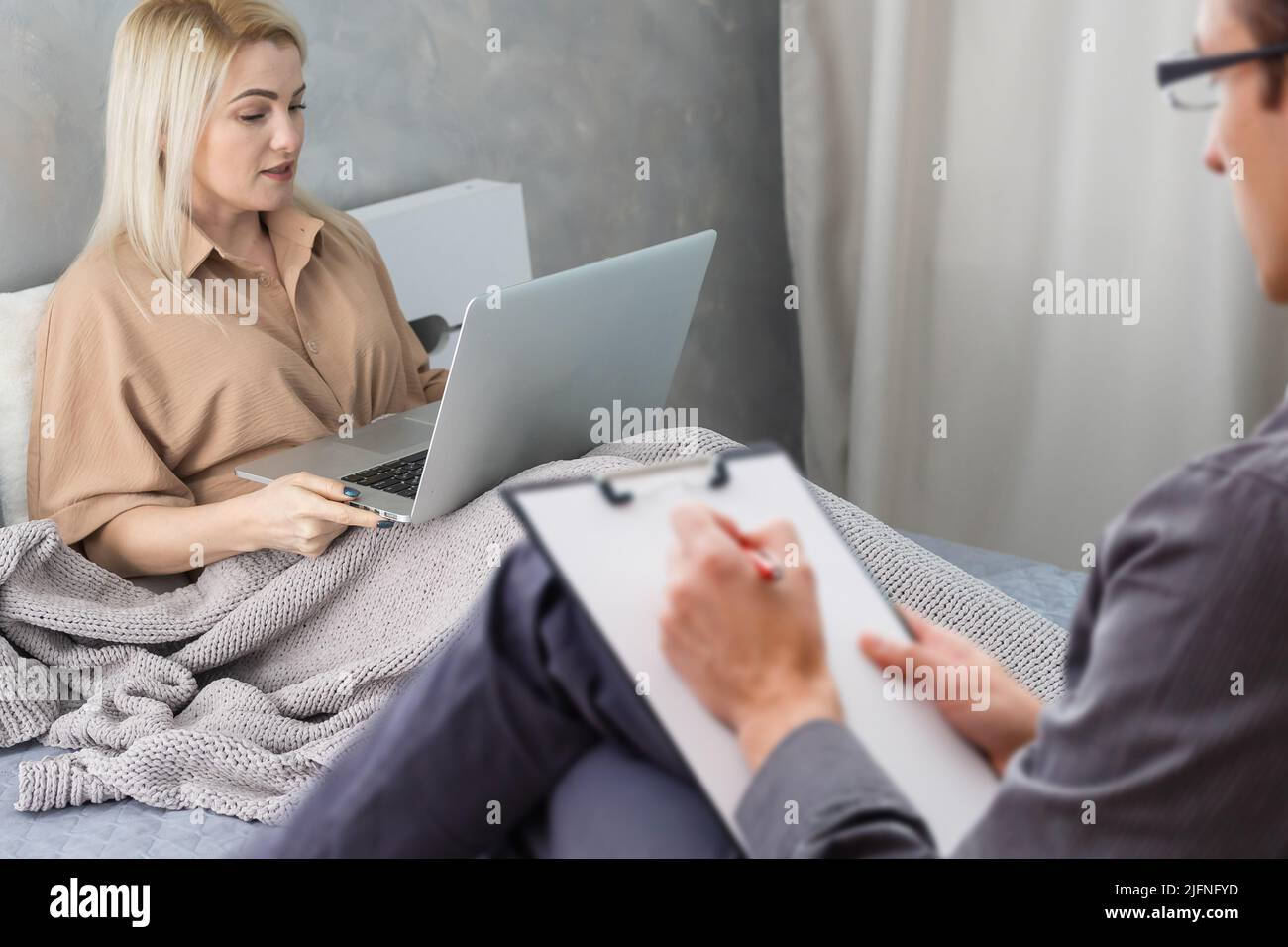 Elegant female woman using portable computer, session with psychologist ...