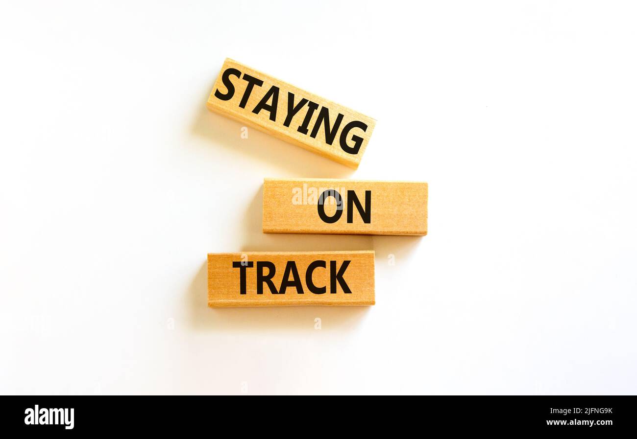 Staying on track symbol. Concept words Staying on track on wooden ...