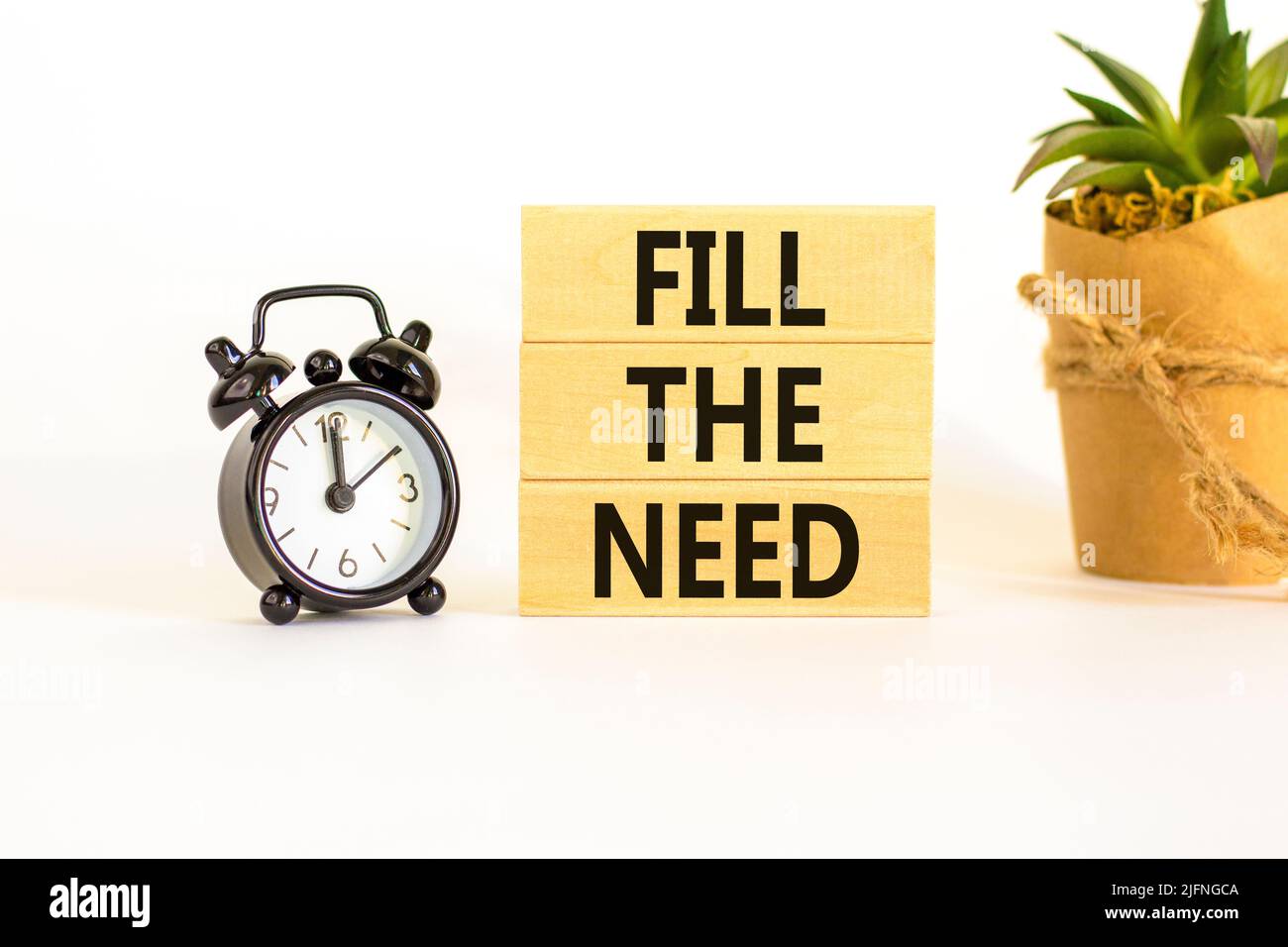 Fill the need symbol. Concept words Fill the need on wooden blocks on a ...