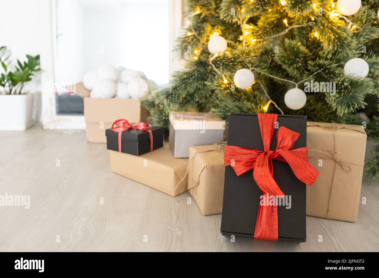 beautiful Christmas gifts under tree in new year decorated house ...