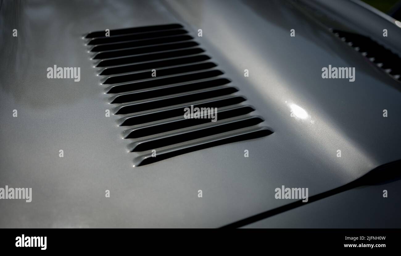 Classic car Jaguar E Type bonnet louver vents Stock Photo - Alamy