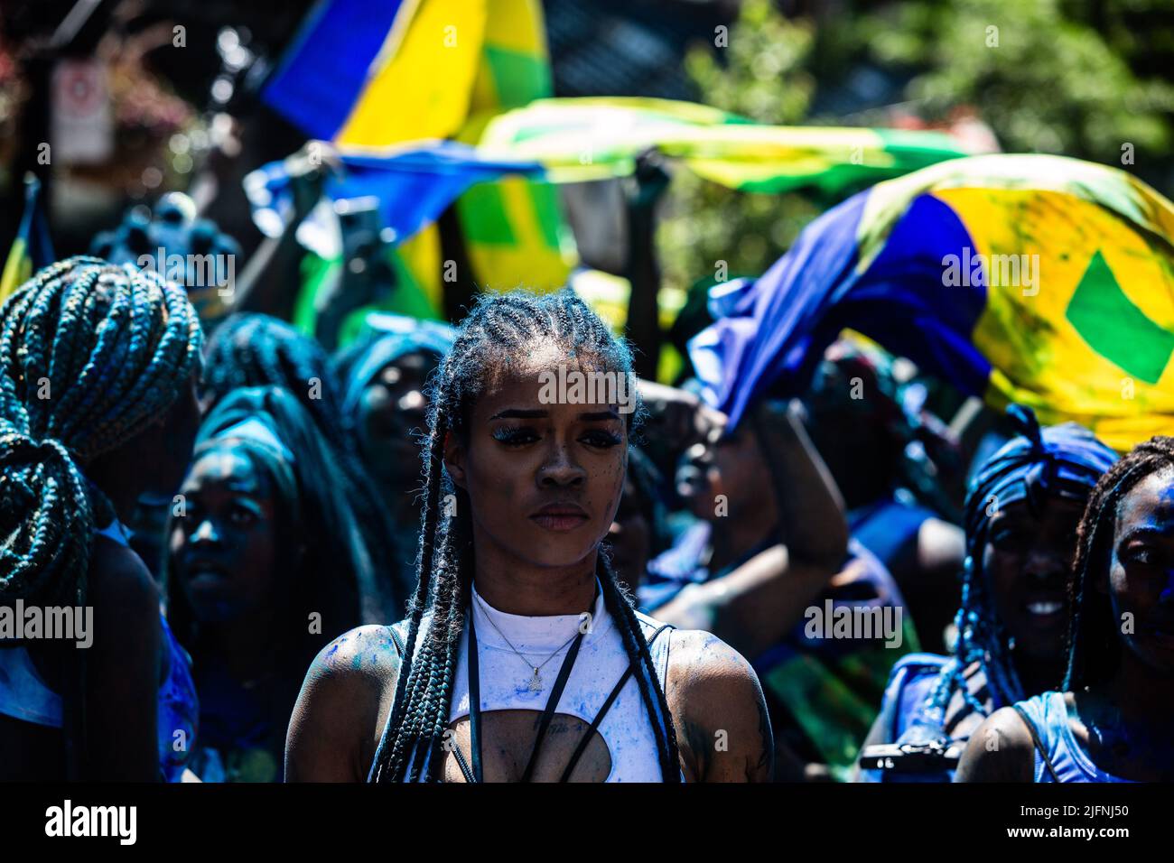 Revellers follow the main float during the parade Stock Photo - Alamy