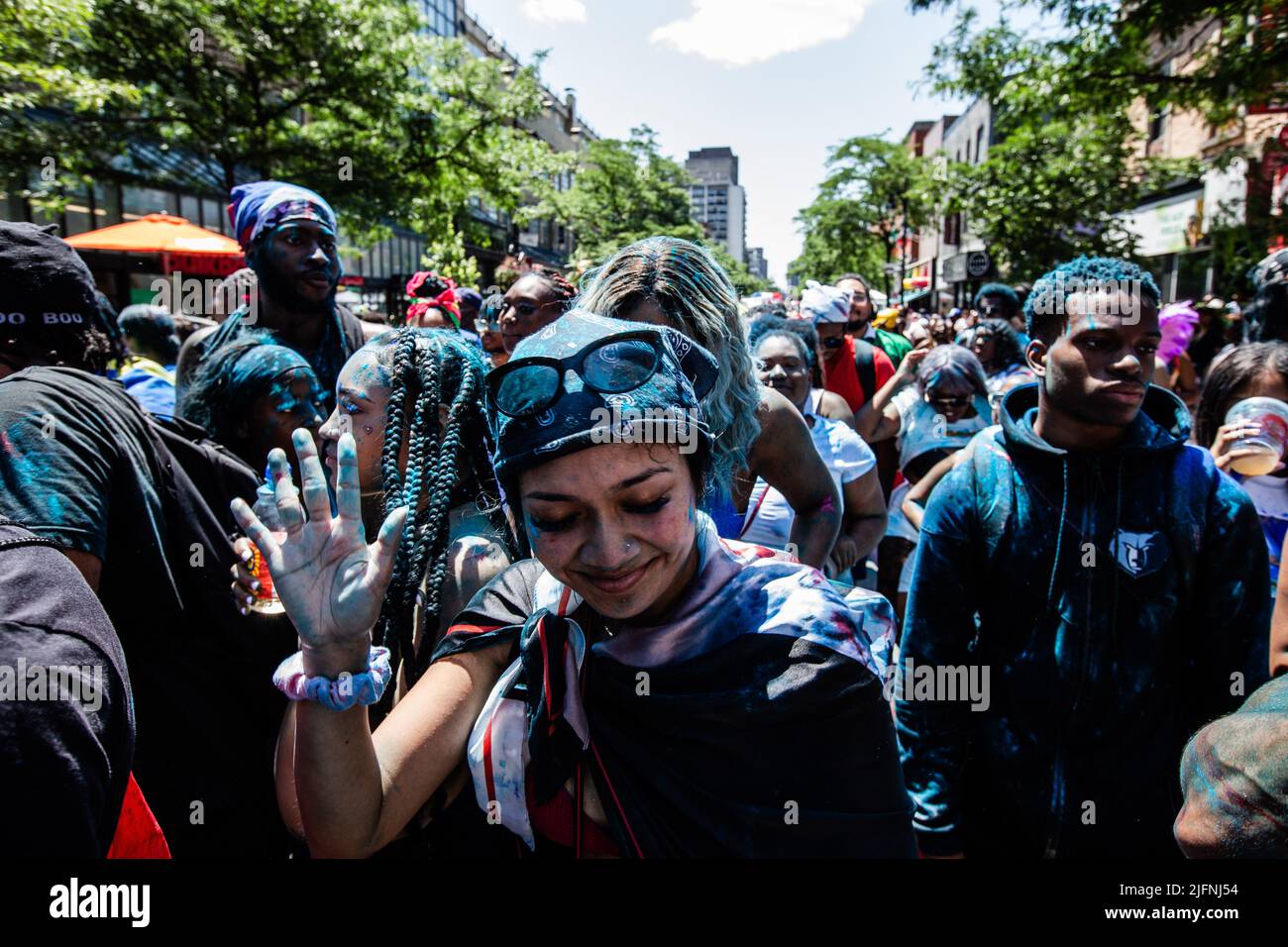 Revellers follow the main float during the parade Stock Photo - Alamy