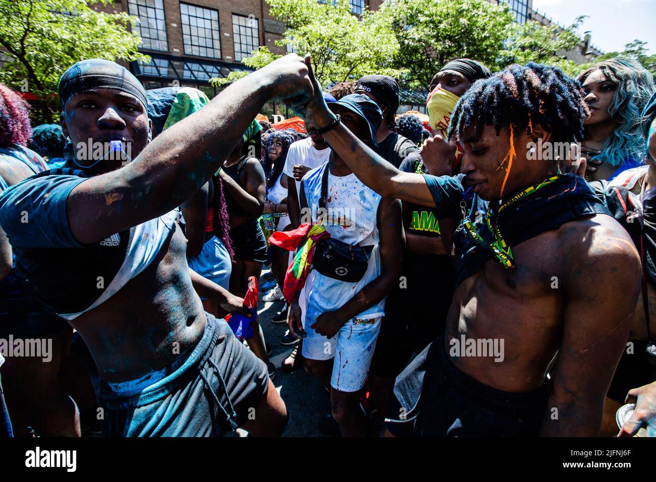 Revellers dance behind the main float during the parade Stock Photo - Alamy