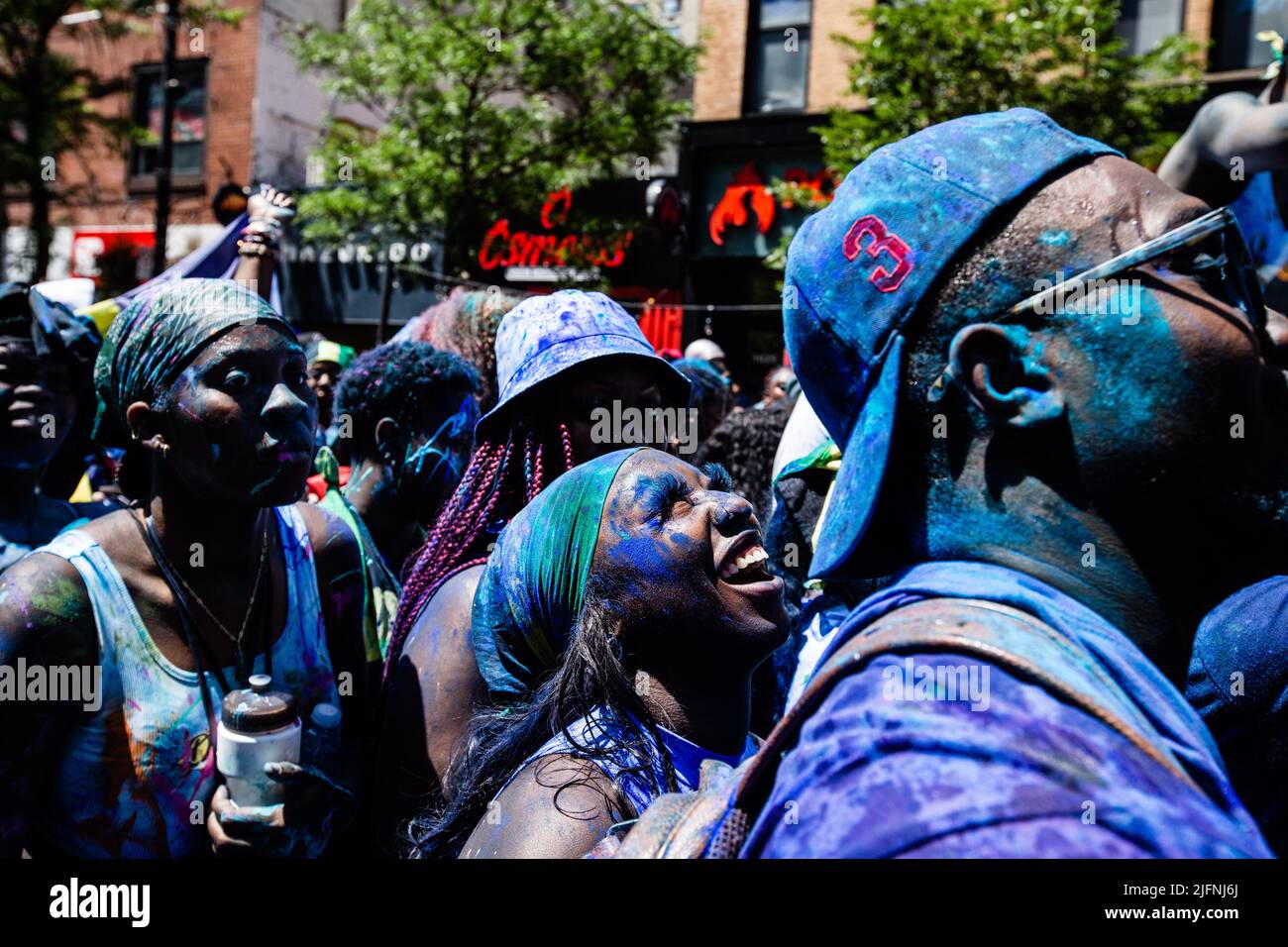 Revellers follow the main float during the parade Stock Photo - Alamy