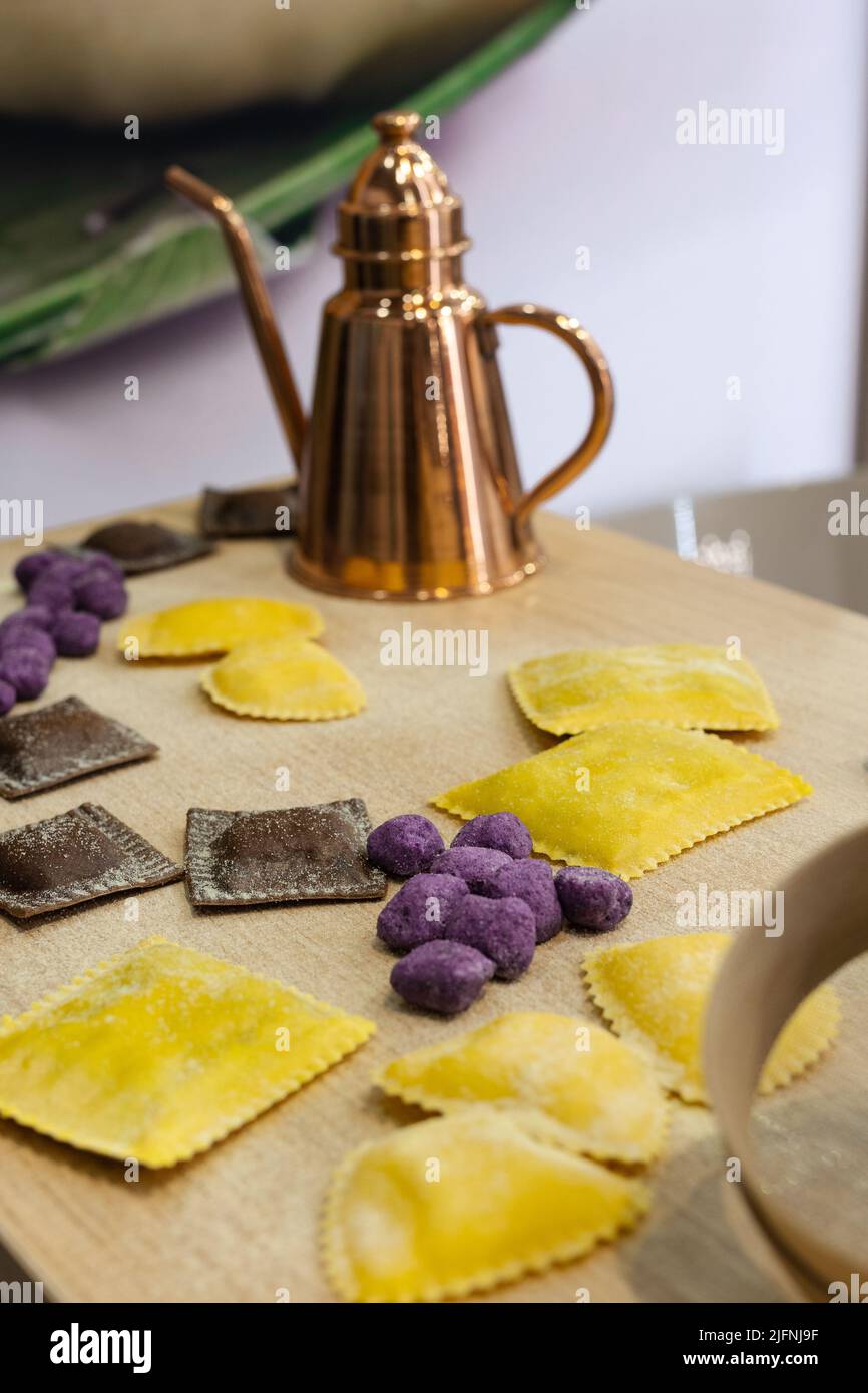 Freshly Made Raw Tortelli and Other Types of Italian Pasta over Wooden ...