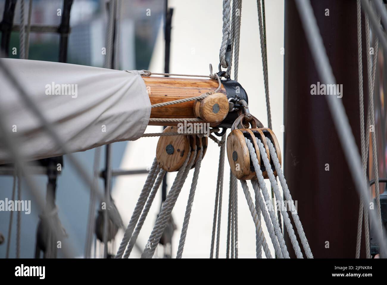 old wooden pulleys for boats Stock Photo - Alamy