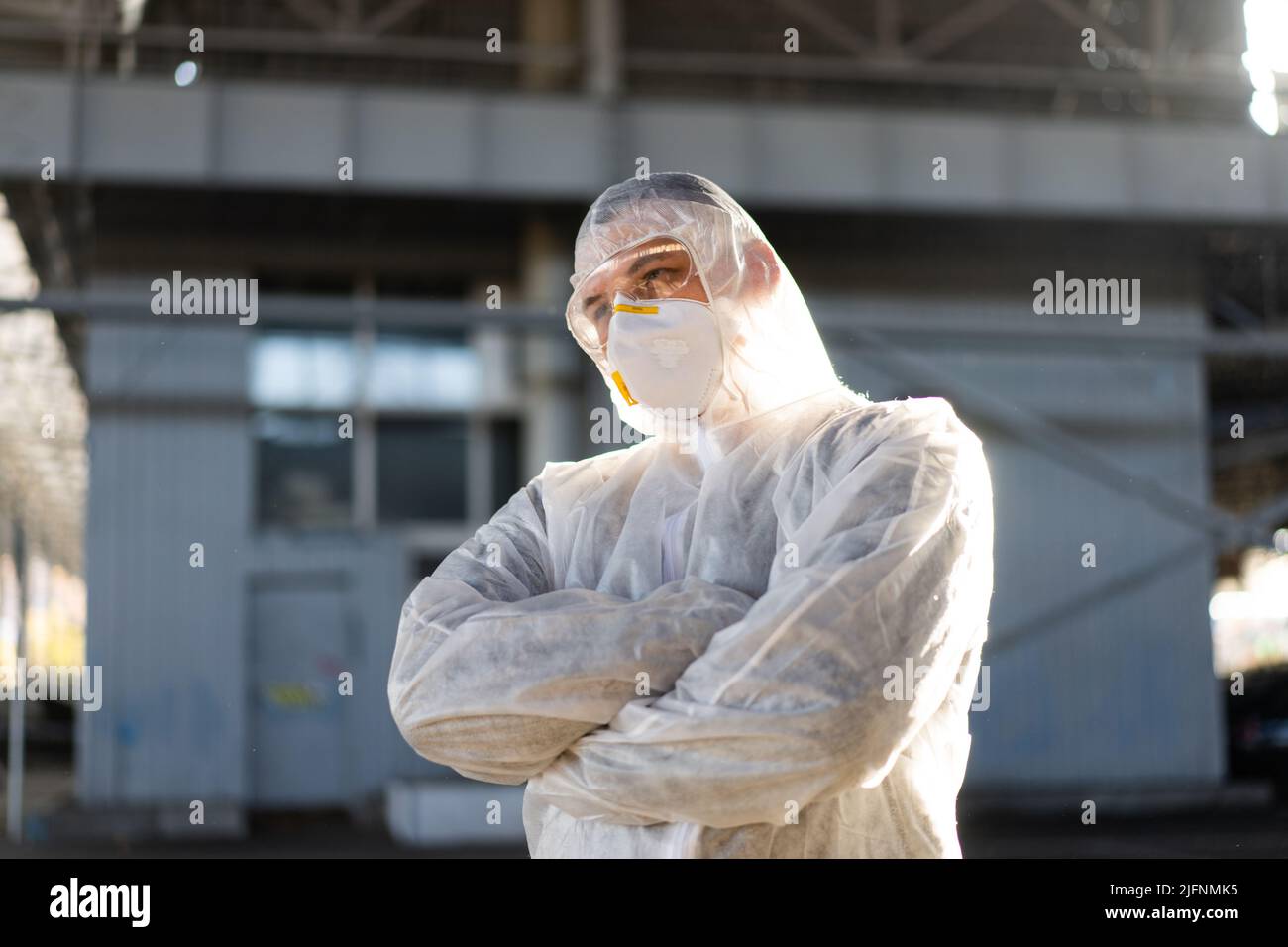 COVID-19 coronavirus doctor standing hospital parking dressed white ...