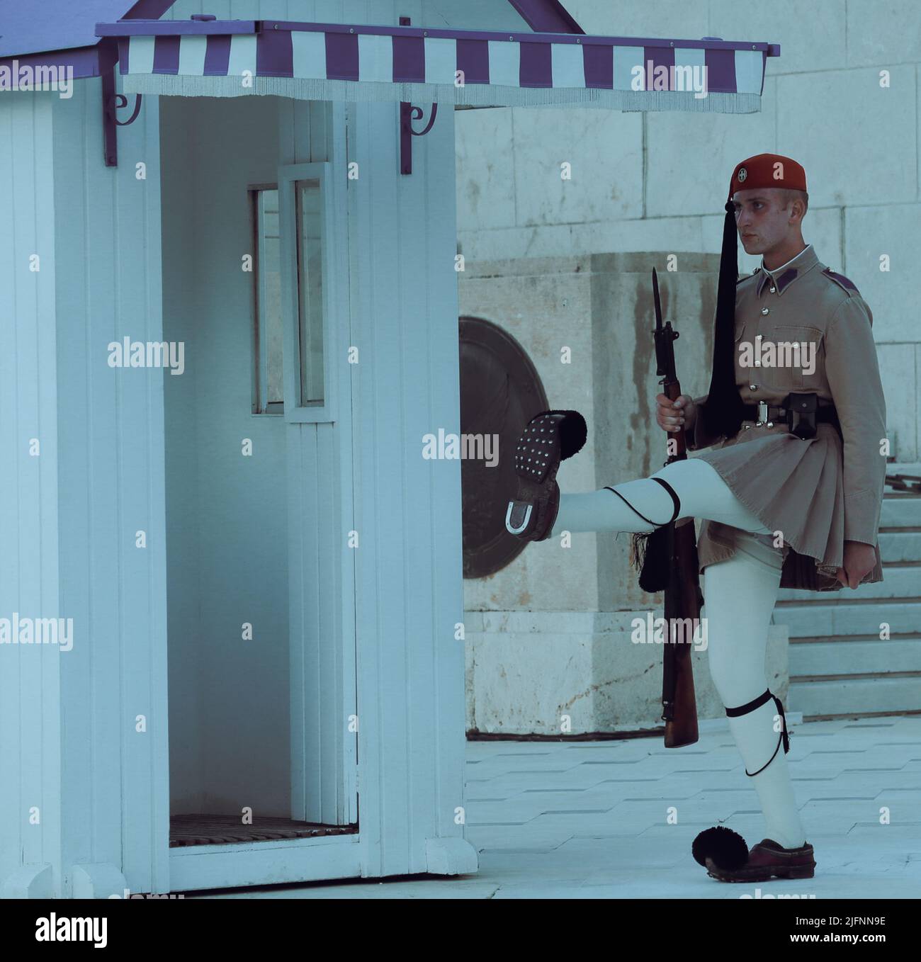 The greek guardian in Athens posing with gun Stock Photo - Alamy