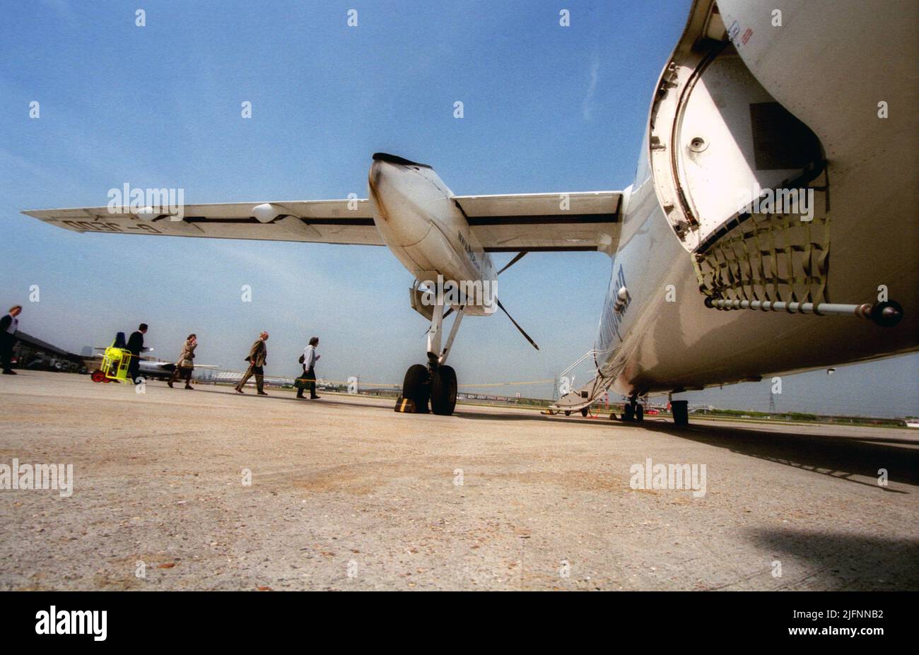 Passengers boarding an airplane from the runway Stock Photo - Alamy