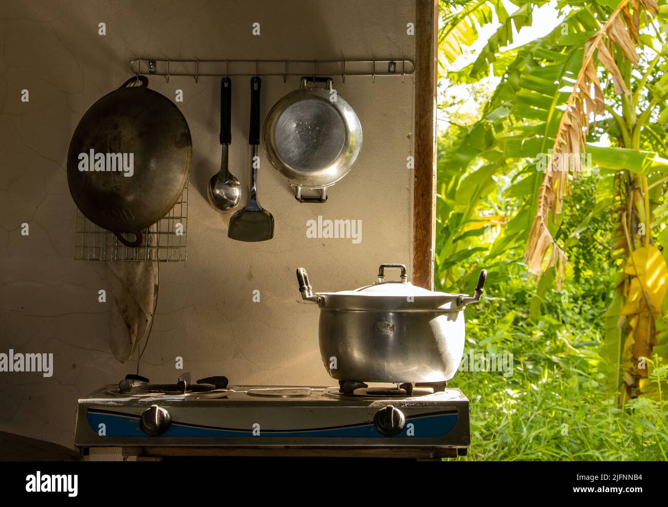 Village kitchen overlooking a tropical garden Stock Photo - Alamy