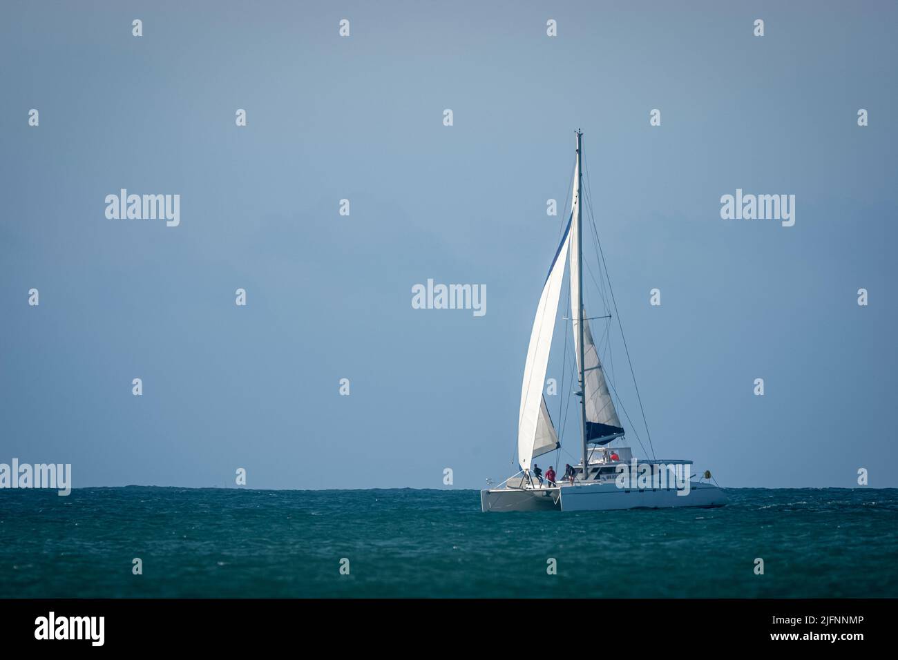 A sailing boat floating in the Indian ocean on a cloudless day in ...