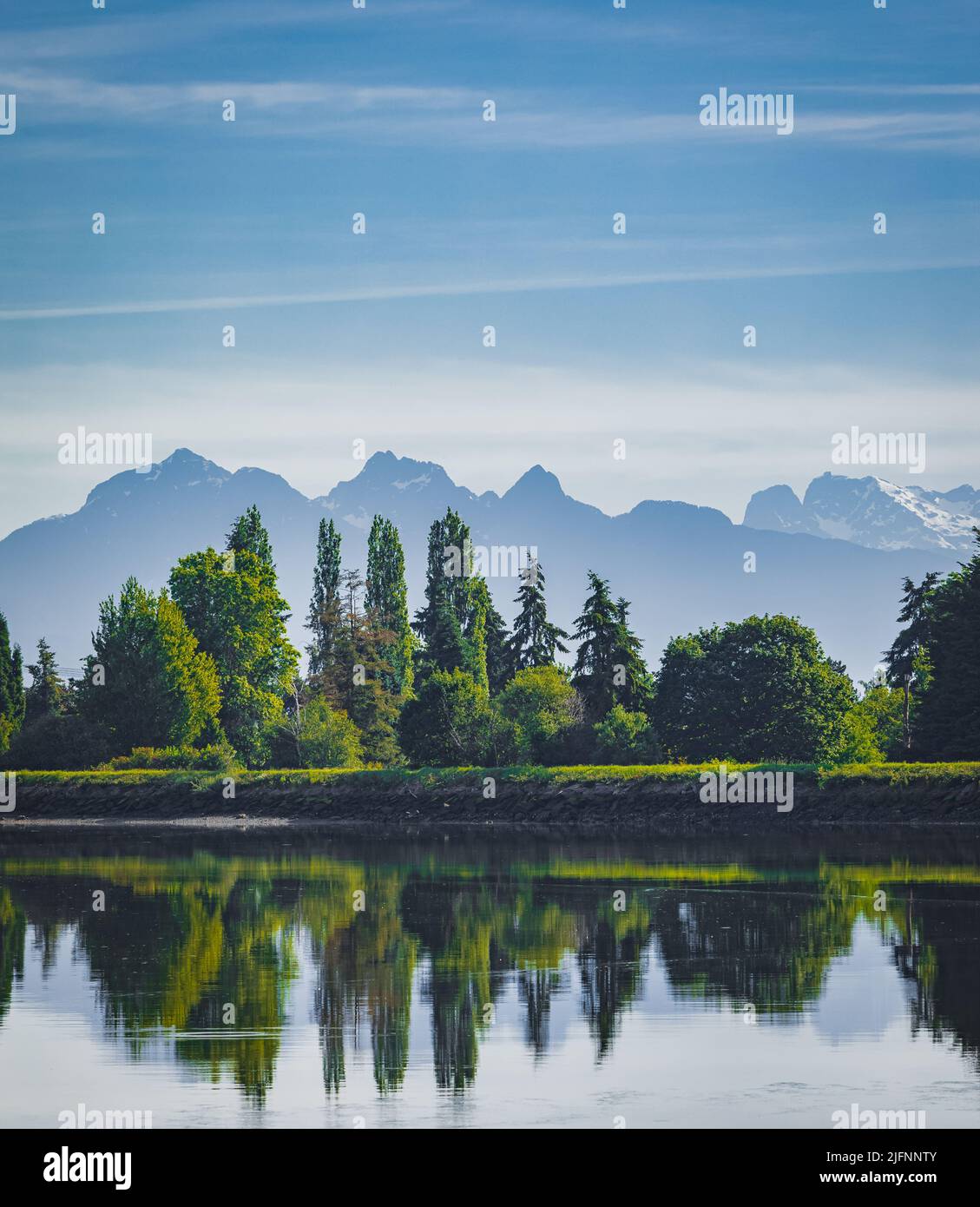 Beautiful scenic landscape view of a river, forest and mountains in the ...