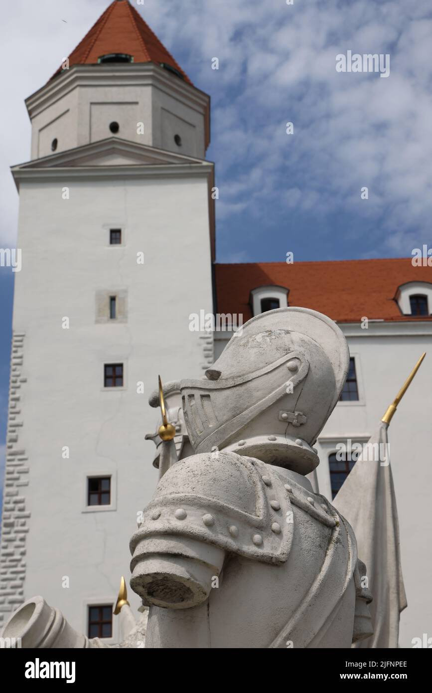 Statue of knight near the Bratislava Castle and tower of Bratislava ...