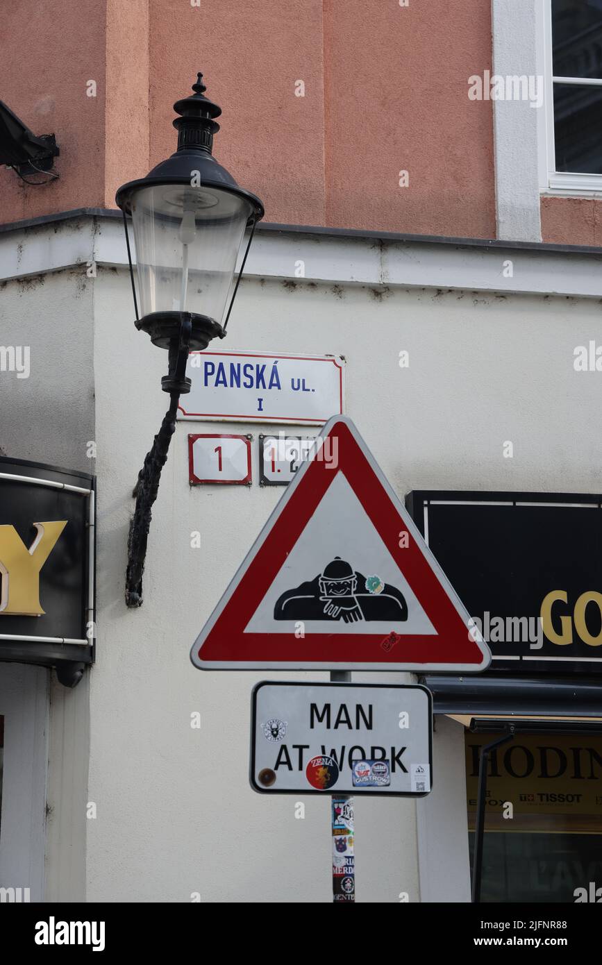 Warning sign next to bronze statue (1997) of sewer worker (Čumil, the ...