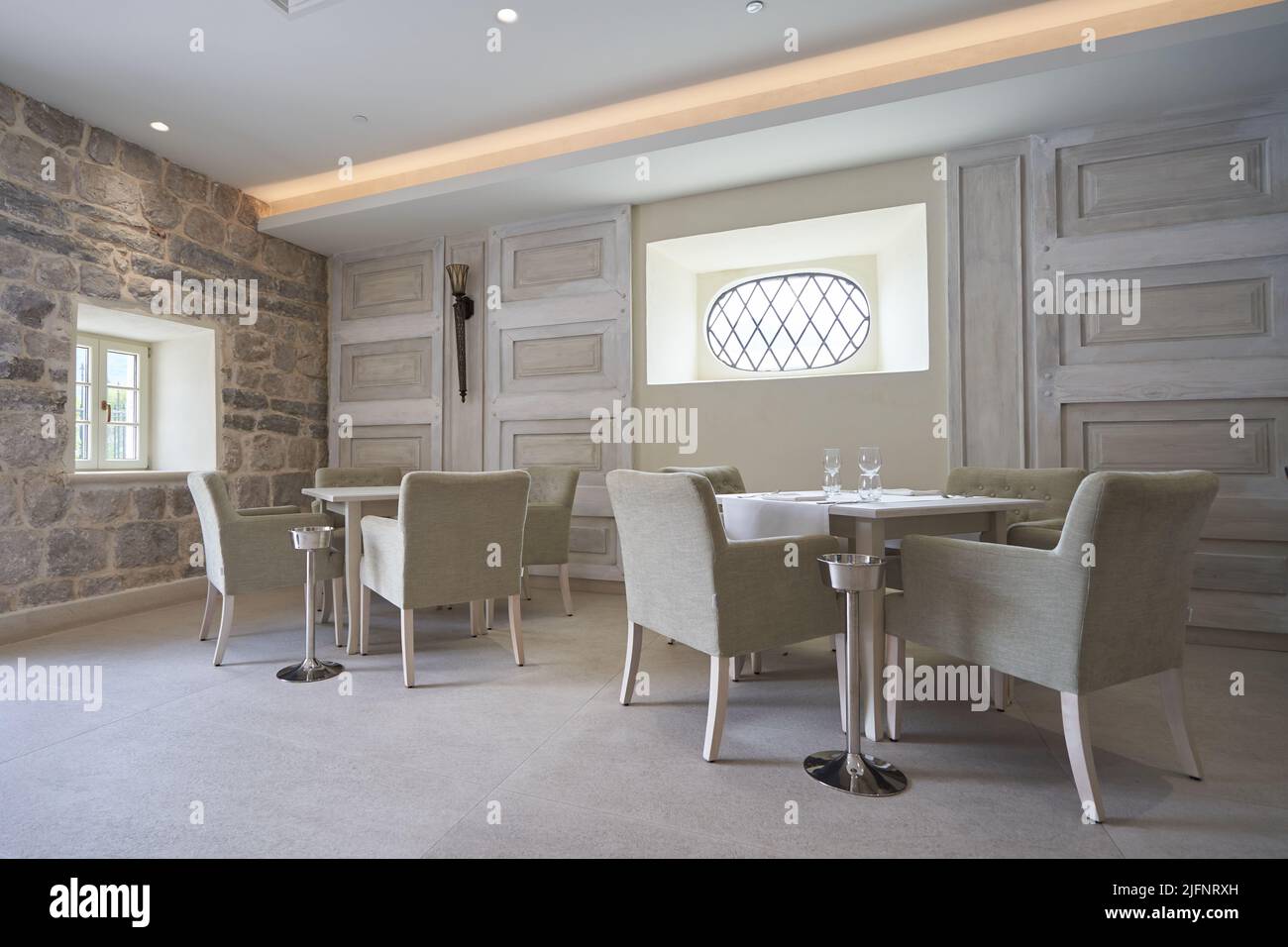 Cozy restaurant interior in beige color with soft armchairs without ...