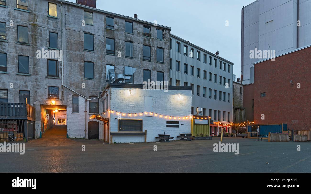 Early morning view of an outdoor coffee shop in an alley at St. John’s ...