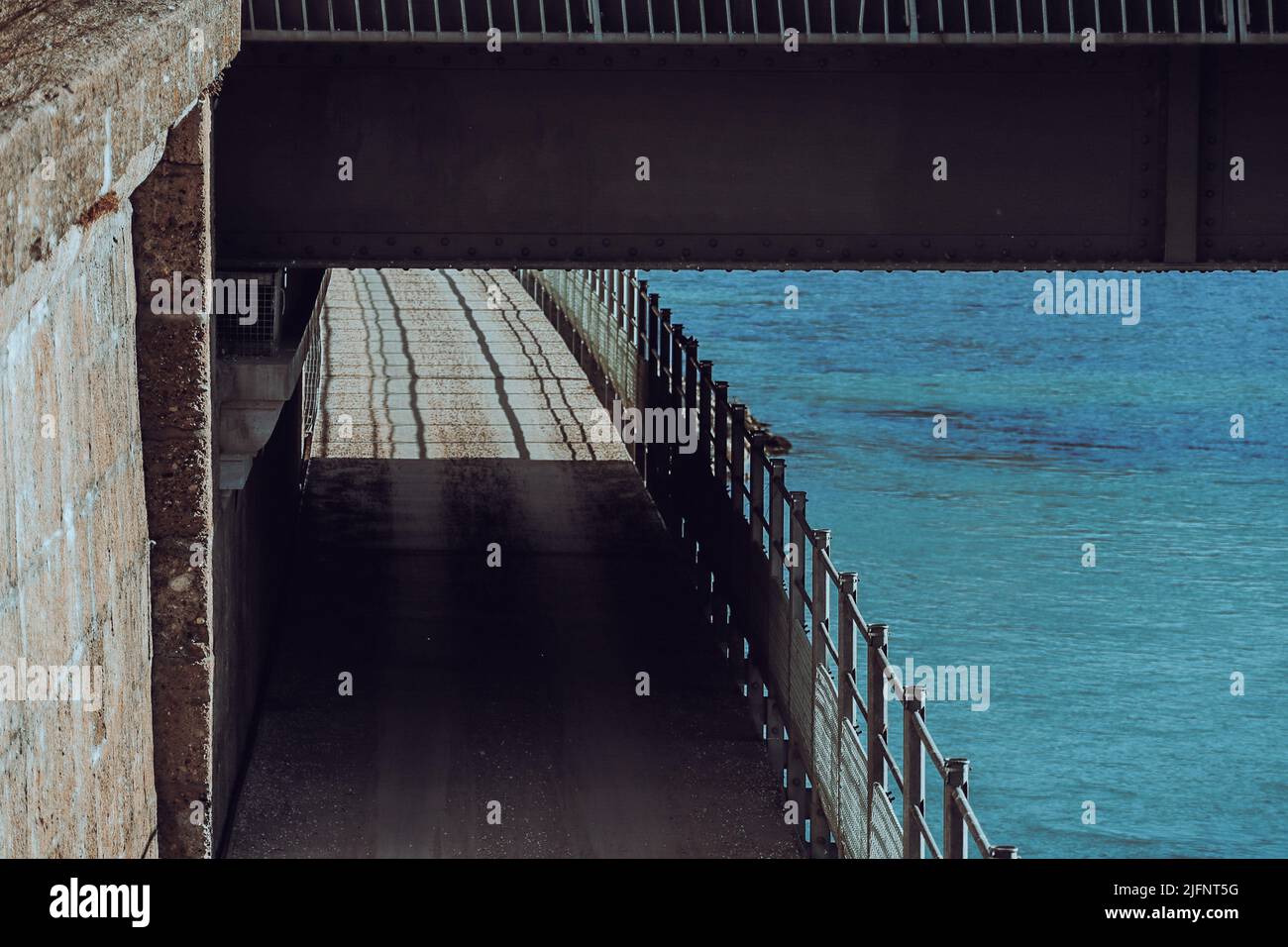 A top view of a bridge on blue clear river Stock Photo - Alamy