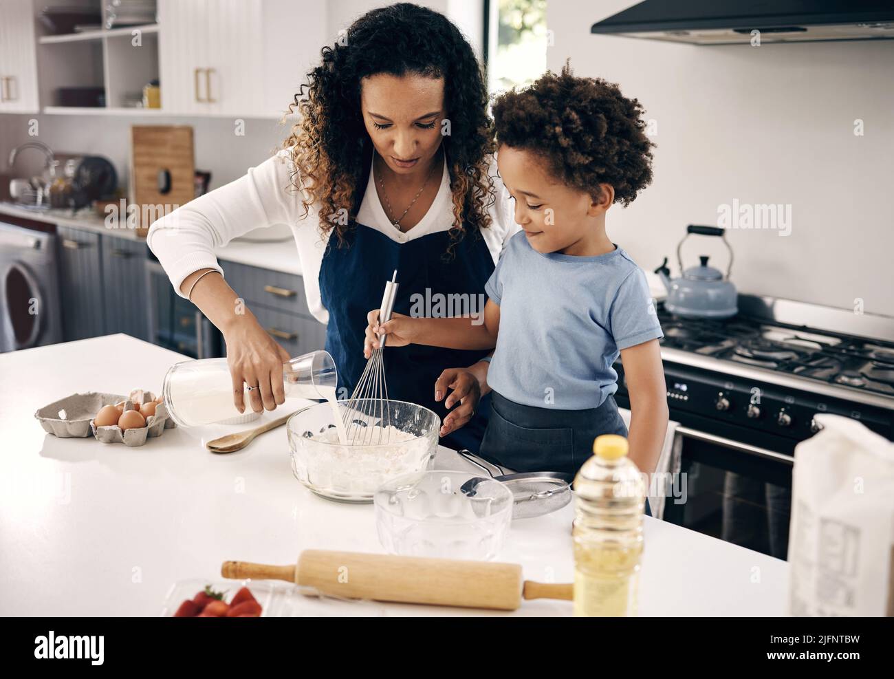 Hispanic mother cooking in kitchen hi-res stock photography and images ...