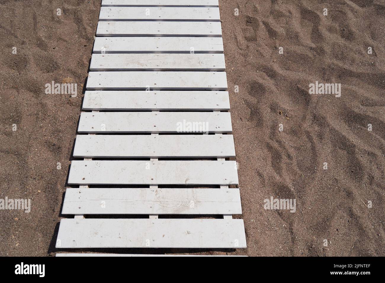 Wooden path on the beach sand for tourists Stock Photo - Alamy
