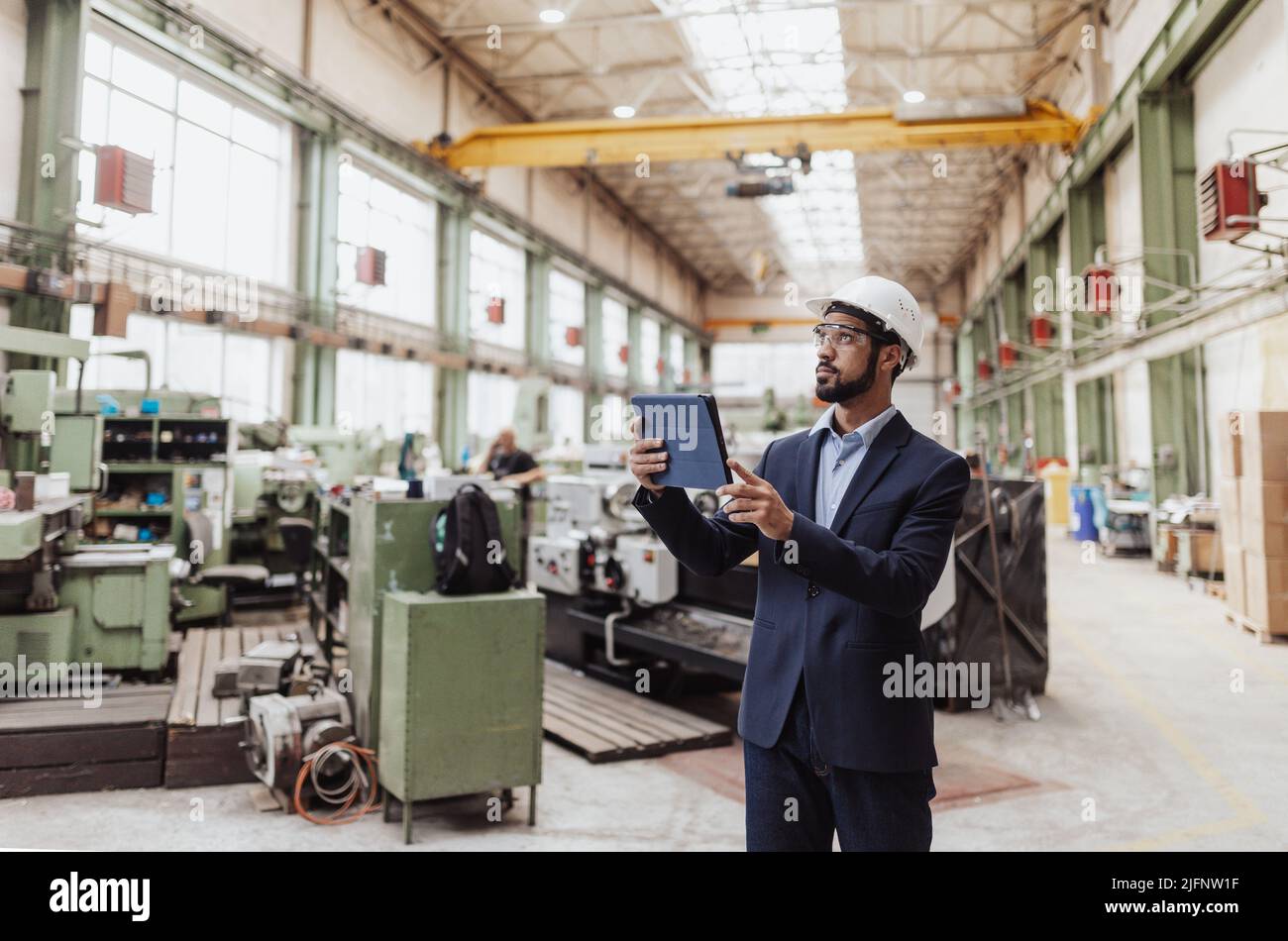Engineering manager doing routine check up in industrial factory Stock ...