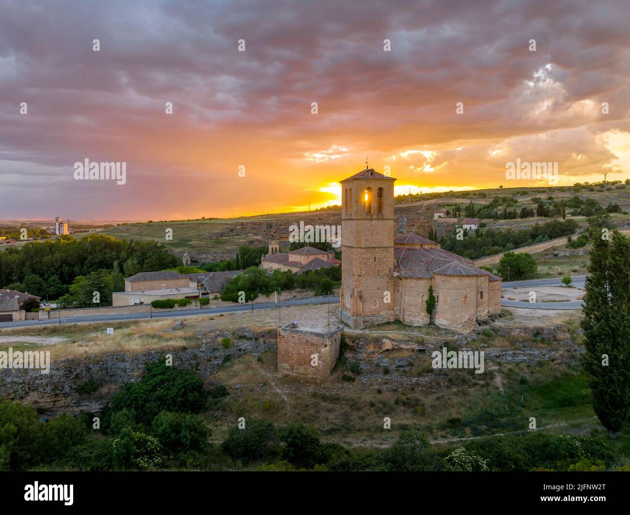 Gorgeous sunset with colorful sky above Segovia Alcazar and Iglesia de ...