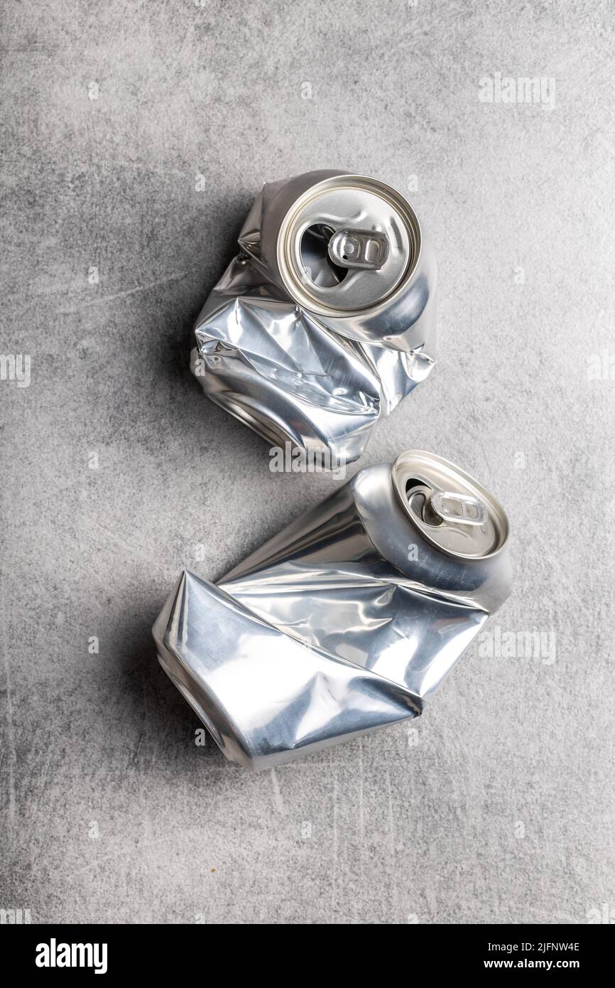 Empty crumpled can on a gray table. Top view Stock Photo - Alamy