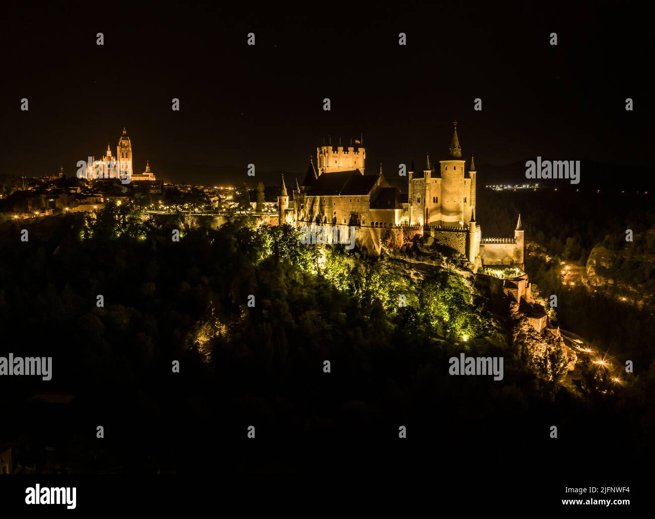 Aerial night view of Segovia medieval center, Alcazar royal palace ...