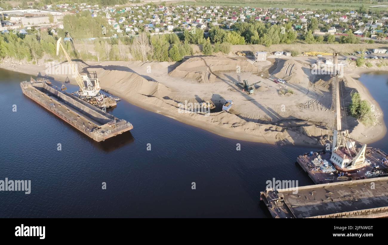 Construction of river embankment. Scene. Top view of construction site ...